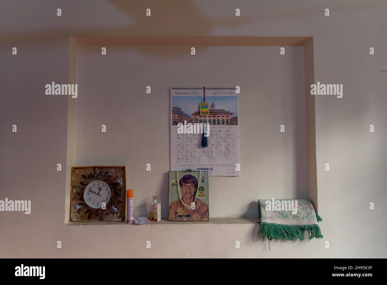 A photograph of Mohammad Ramzan is seen lying on a shelf in a room at ...