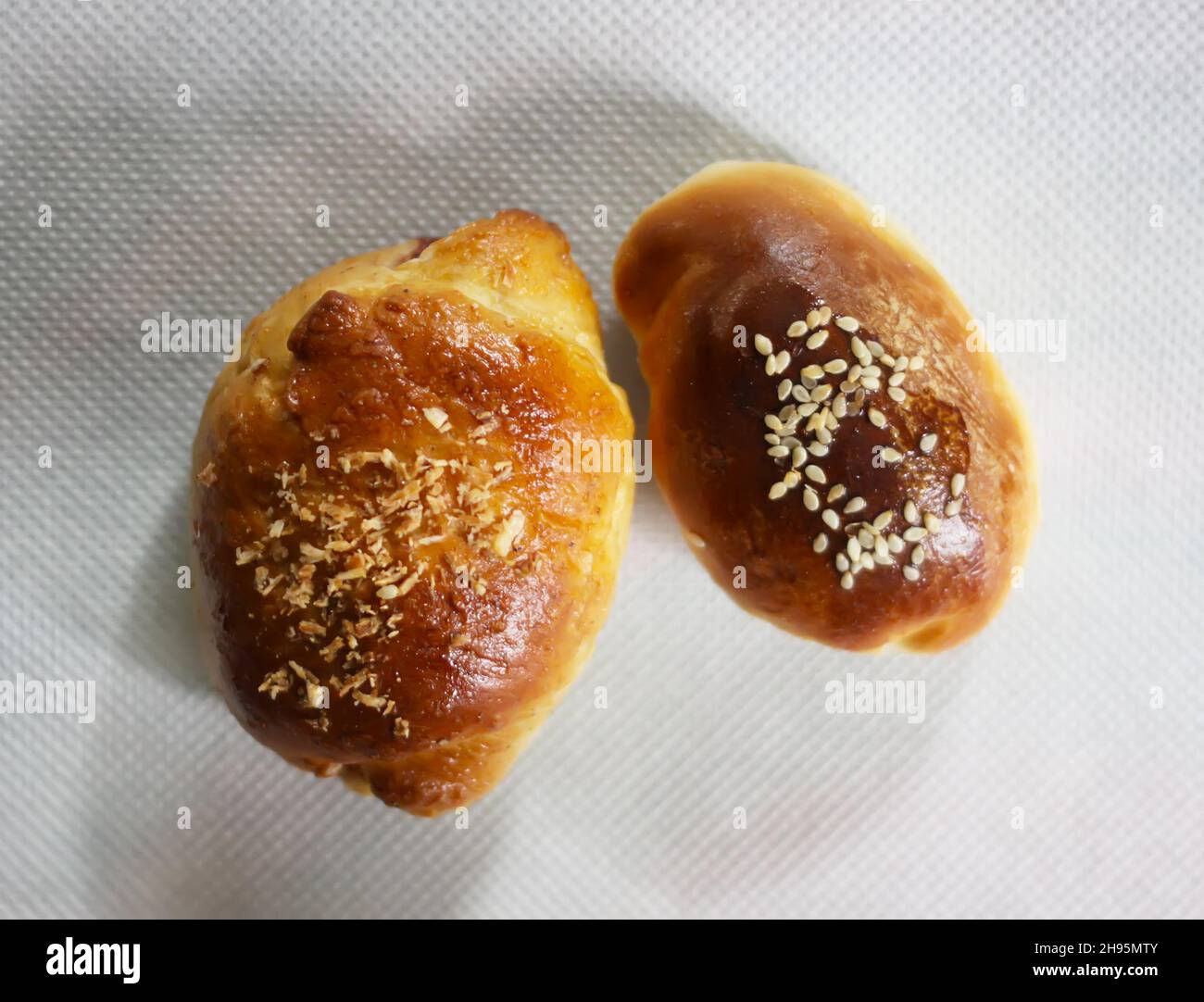 homemade sweet buns with sesame seeds Stock Photo - Alamy