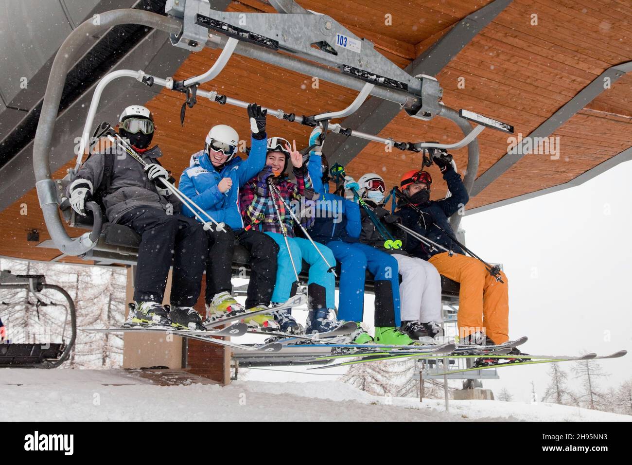 Chantemerle, France. 04th Dec, 2021. Skiers sit on the chairlift and ...