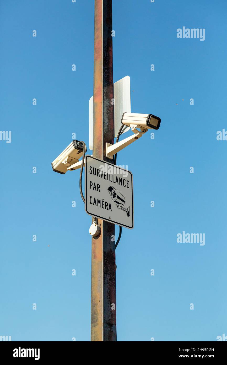 Camera surveillance French sign with two cameras installed on a post ...