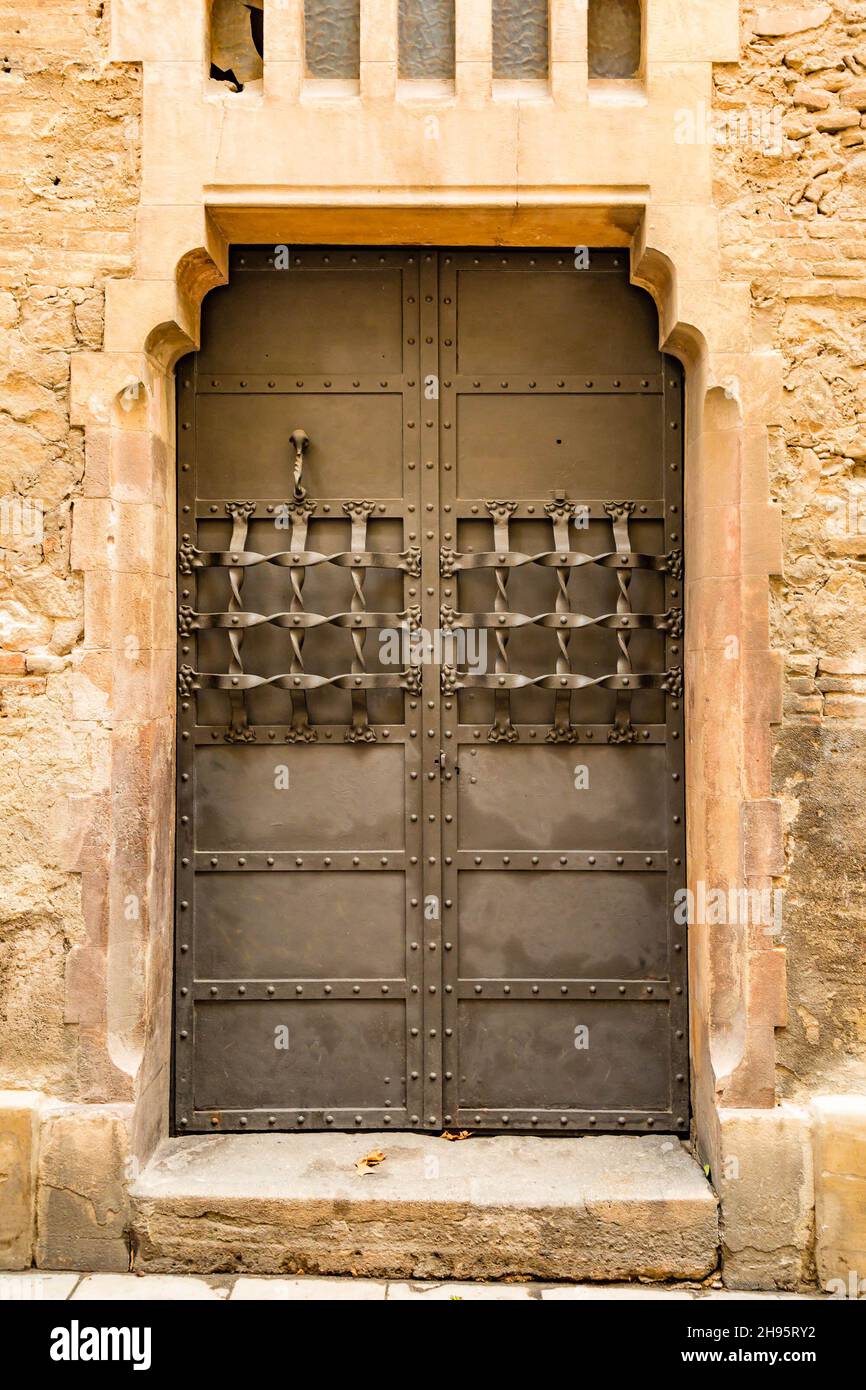 Medieval door made of metal with detailled grid and concrete doorstep ...