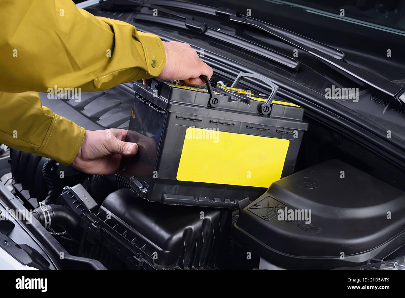 Vehicle battery installation Stock Photo - Alamy