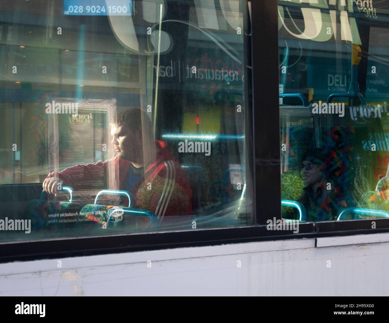 Riding a bus in Belfast Northern Ireland Stock Photo - Alamy