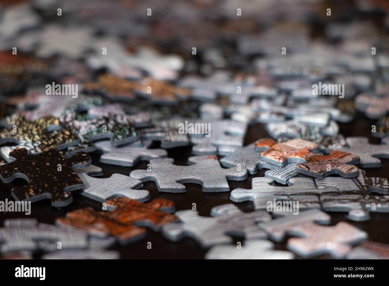 Pieces of a puzzle. Close-up view jigsaw puzzle Stock Photo - Alamy