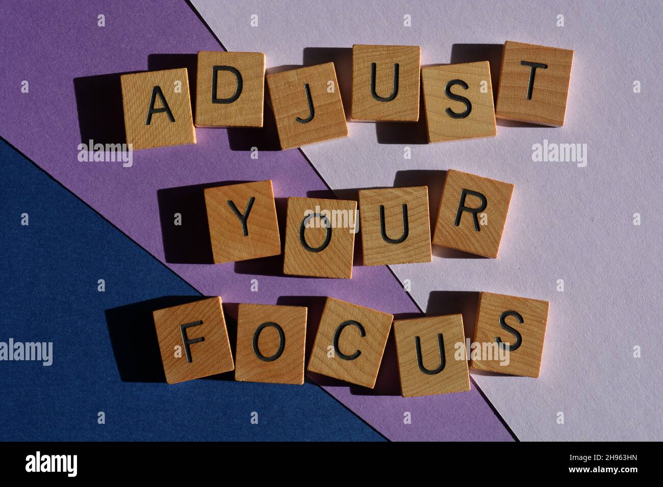 Adjust Your Focus, positive phrase in wooden alphabet letters isolated ...