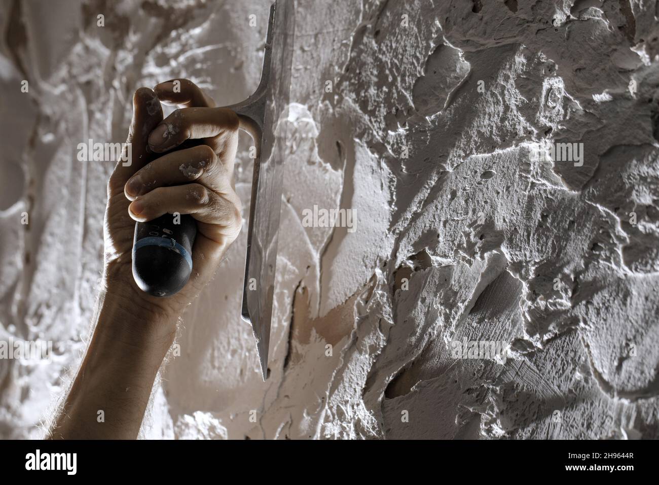 Process of creating white textured clay wall with cracks and ...