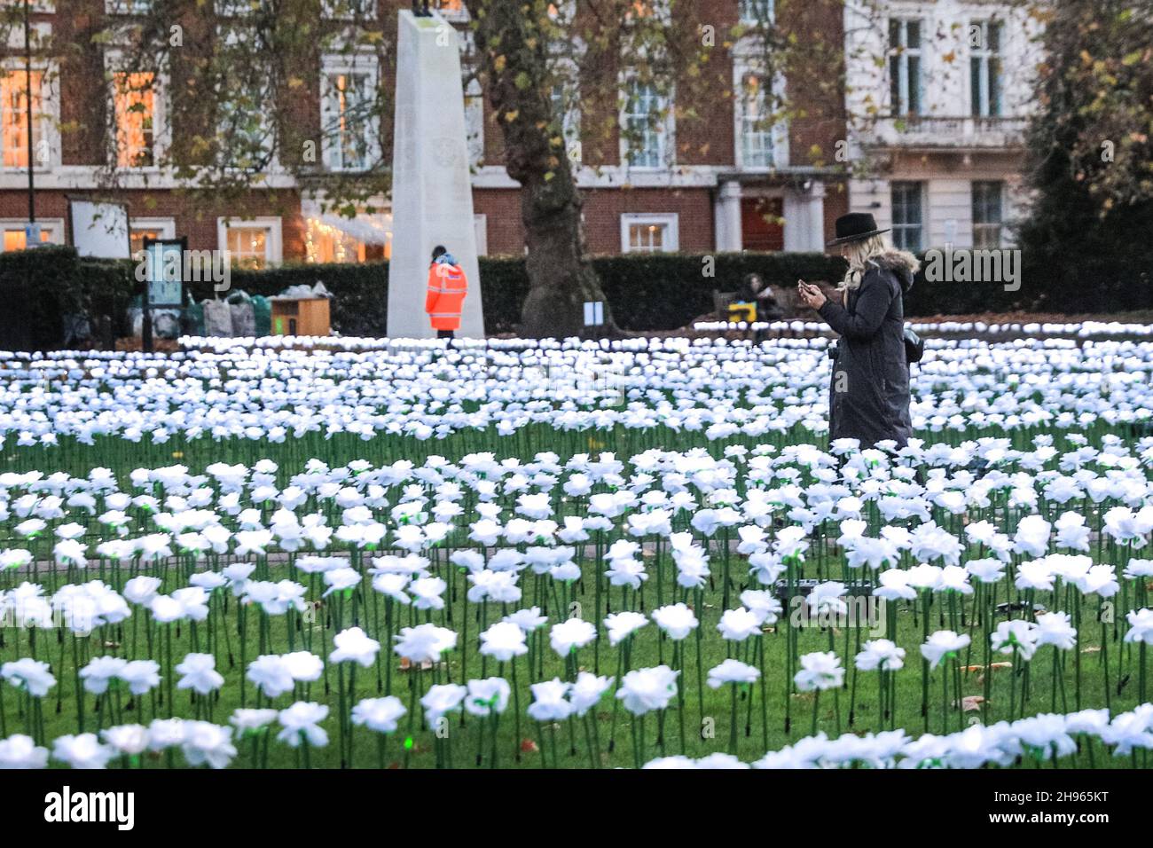 London, UK. 4th Dec, 2021. People walk around the Ever After Garden ...