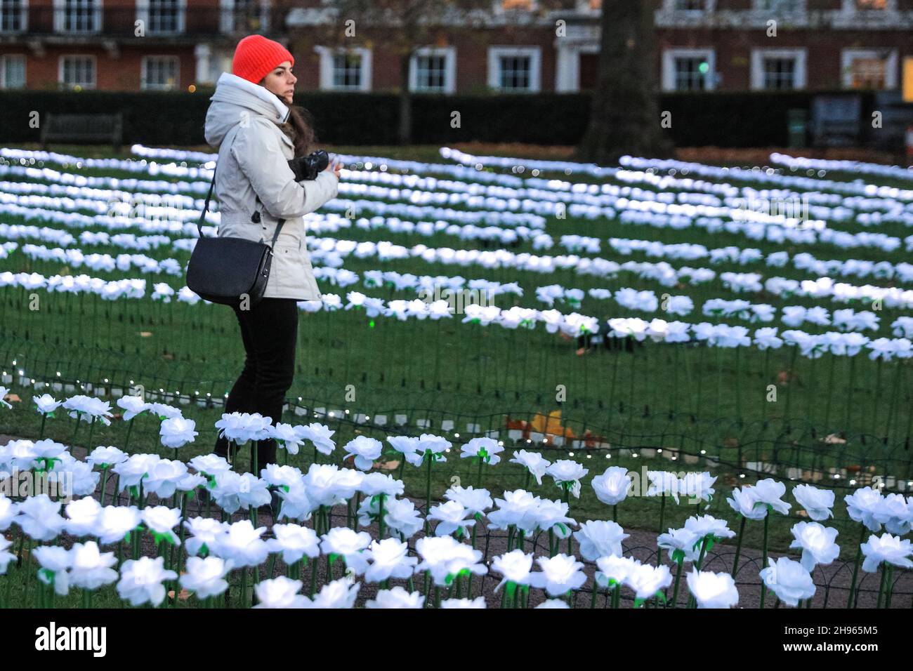 London, UK. 4th Dec, 2021. People walk around the Ever After Garden ...