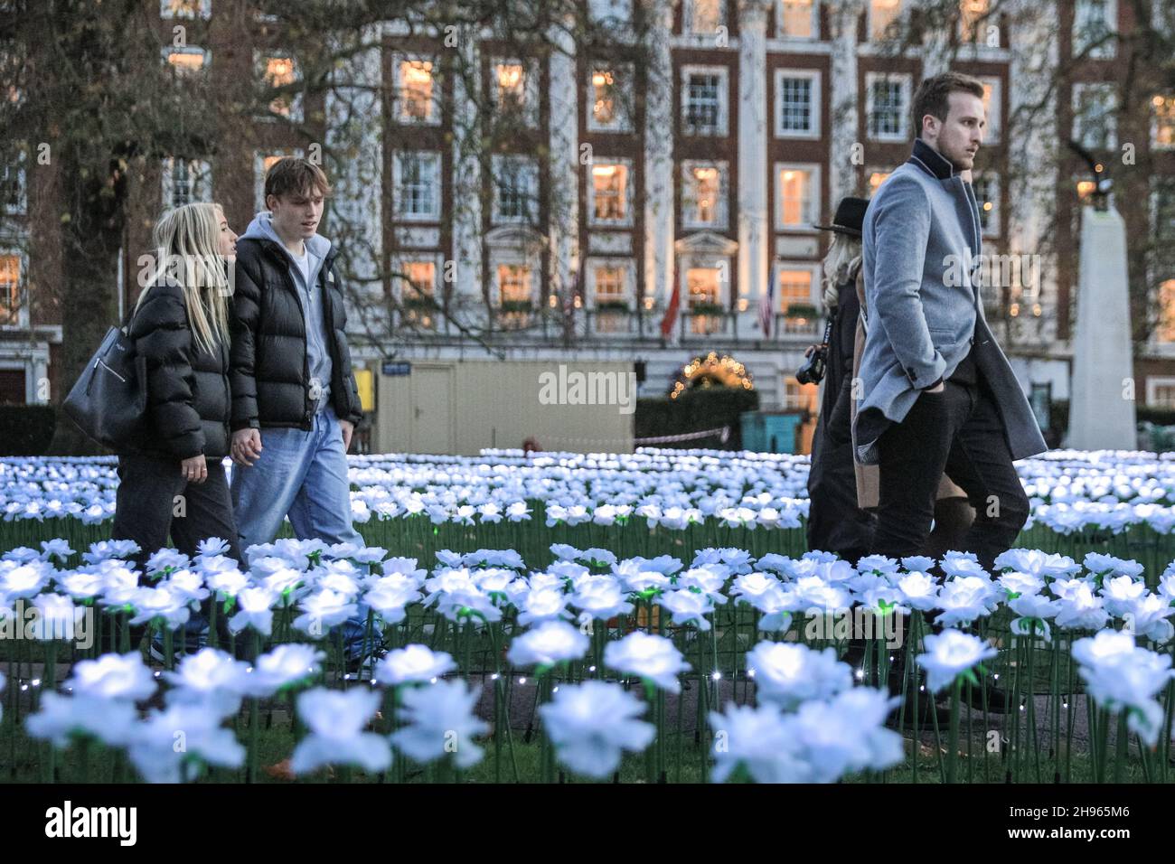 London, UK. 4th Dec, 2021. People walk around the Ever After Garden ...