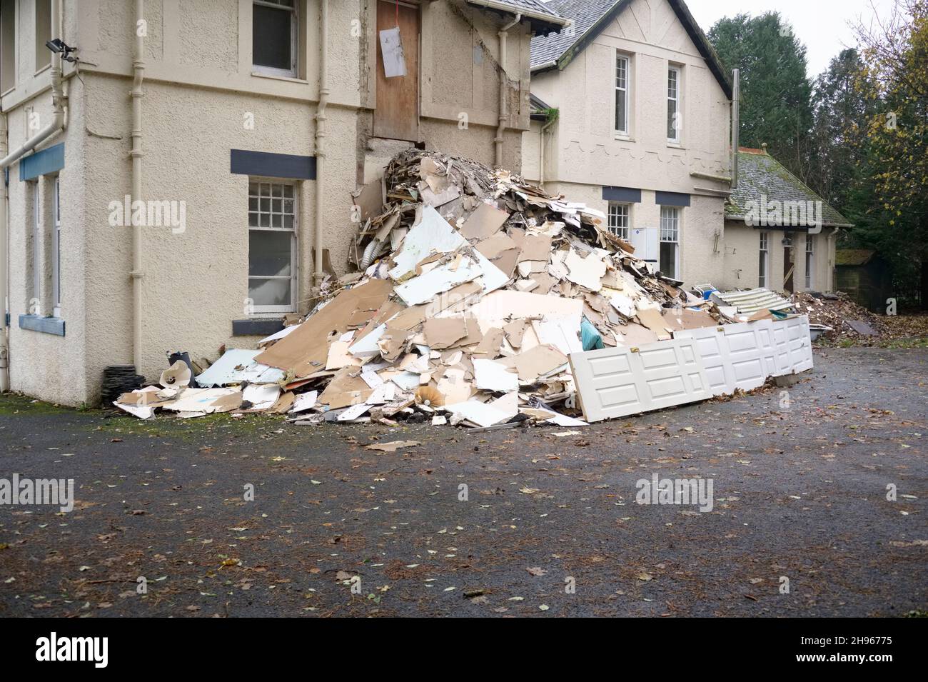 Demolition in progress of derelict house on construction building site ...