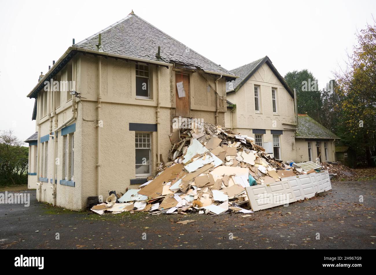 Demolition in progress of derelict house on construction building site ...