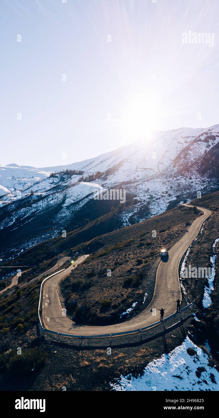 Aerial view of a mountainous landscape with a pathway and peaks covered ...