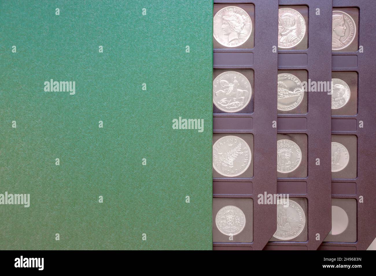 Numismatic album with antique coins collection. Green numismatic case ...