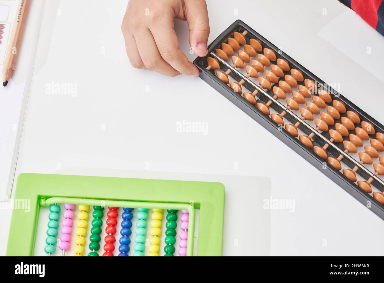 Schoolboy do mental math. Mental mathematics. 8 years old multiracial ...