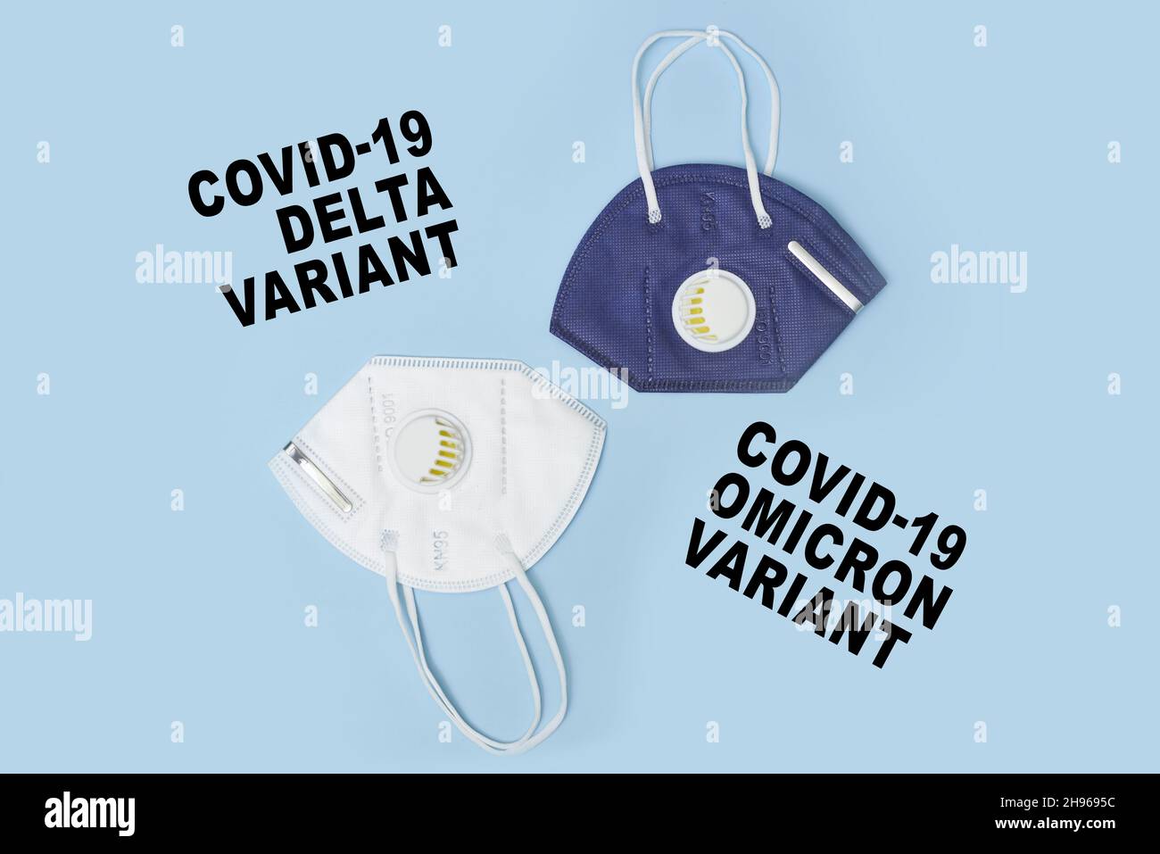 Female doctor holds a face mask with - Omicron variant text on it ...