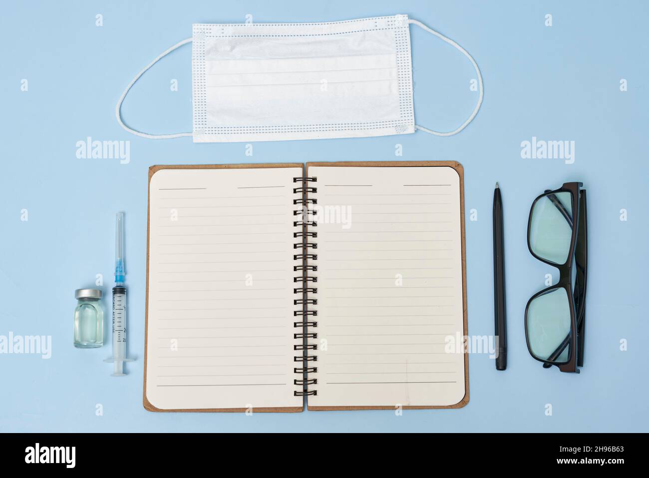 New omicron variant of Covid-19 text on notepad. Workspace or working ...