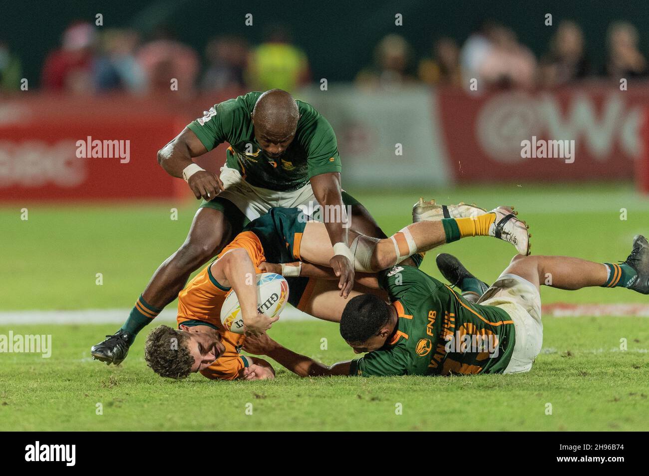 Ben Dowling of Australia ( in gold) is tackled by Shilton van Wyk and ...