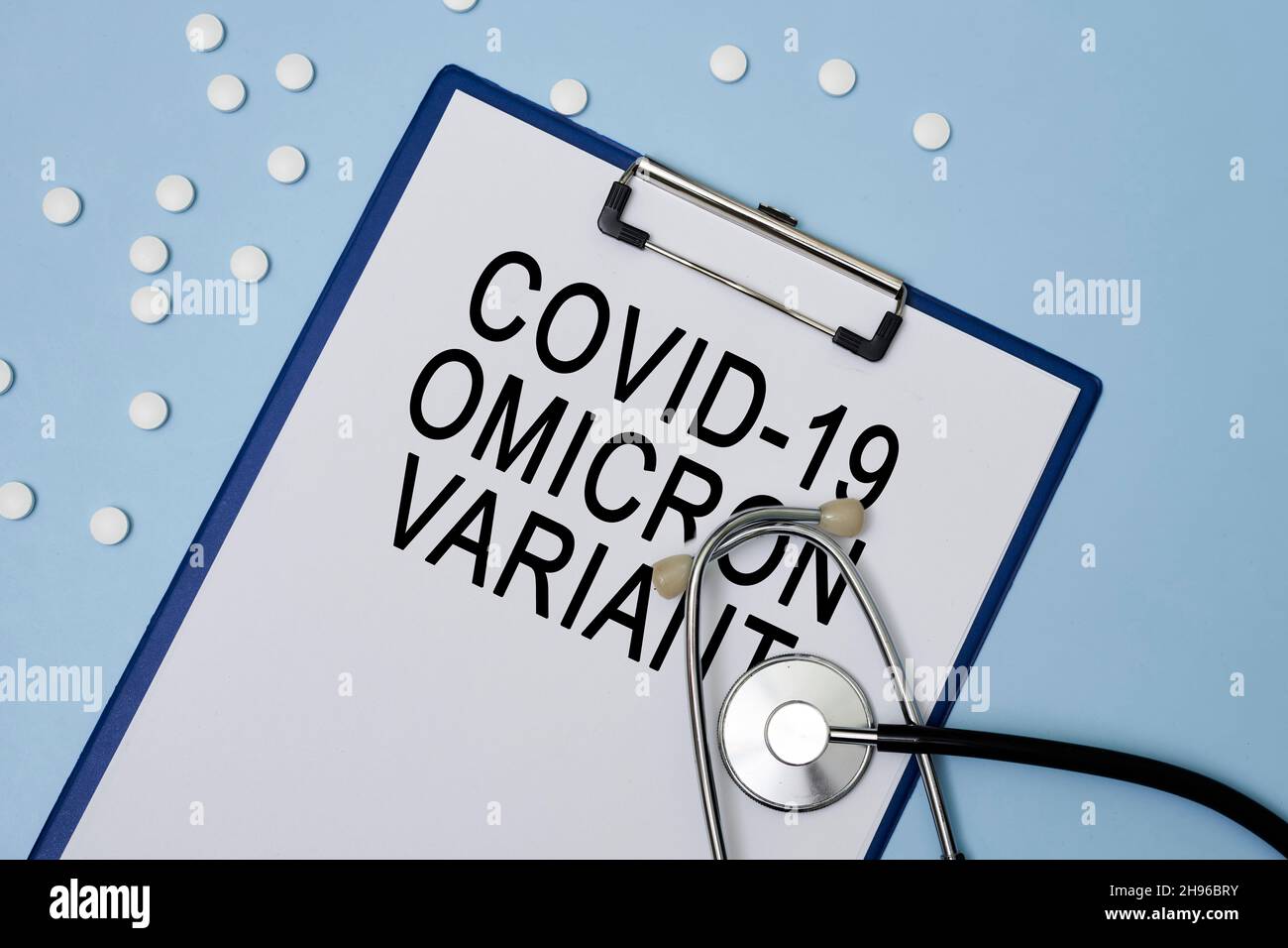 A clipboard with Covid Omicron variant text and stethoscope. Medical ...