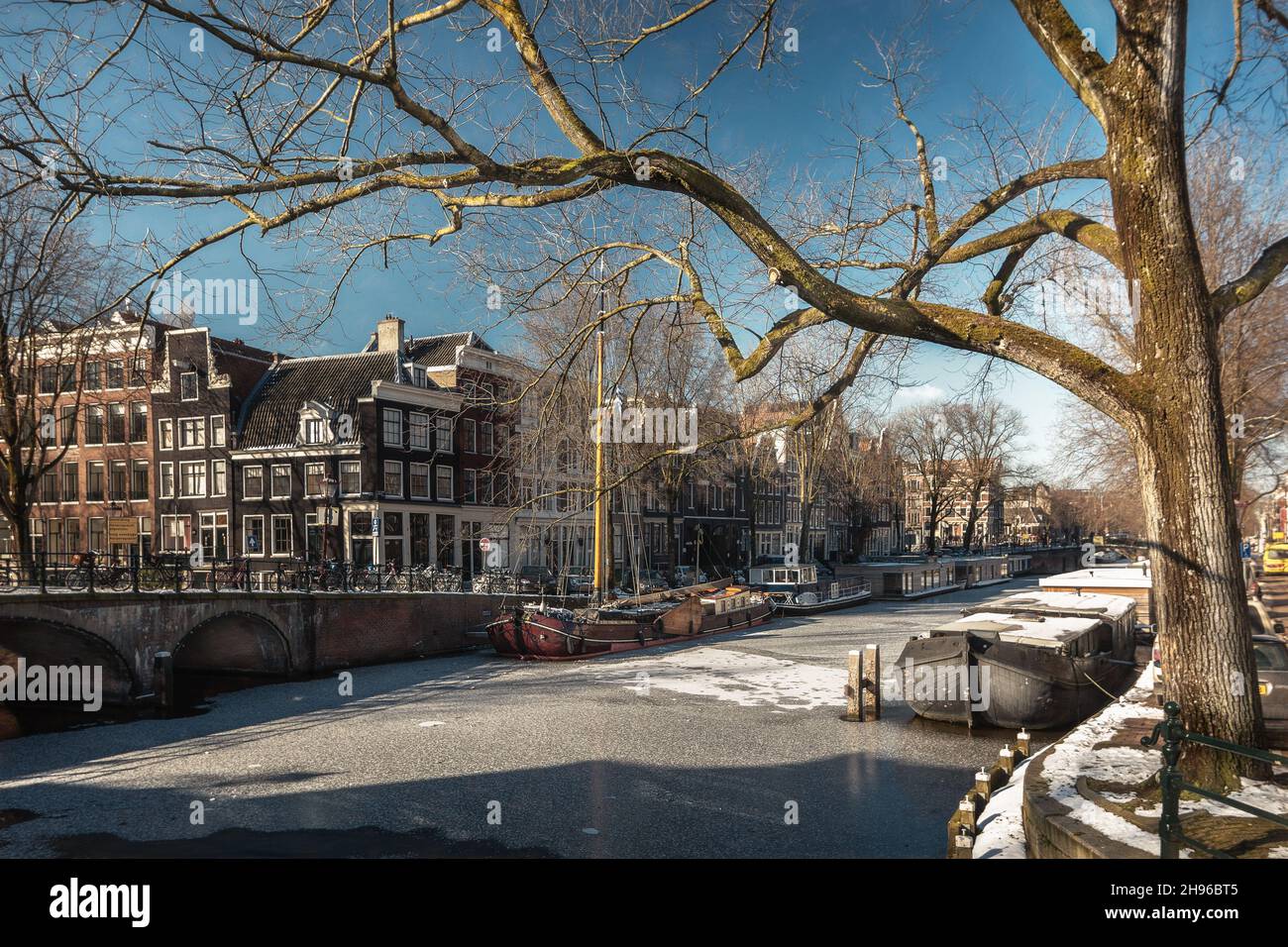 Amsterdam, Netherlands, February 12, 2021: View of the frozen canals in ...