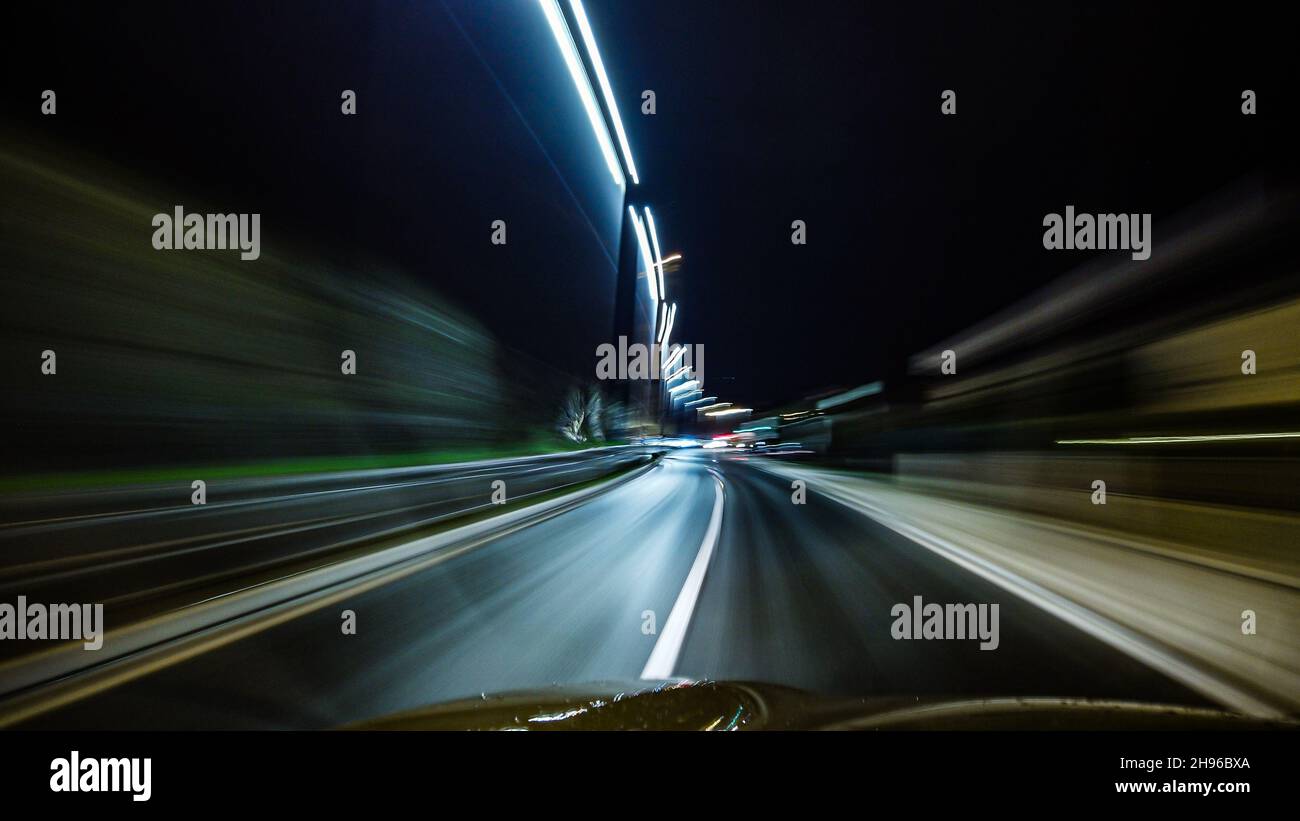 Shallow focus shot of an expressway from a fast-driving car Stock Photo ...