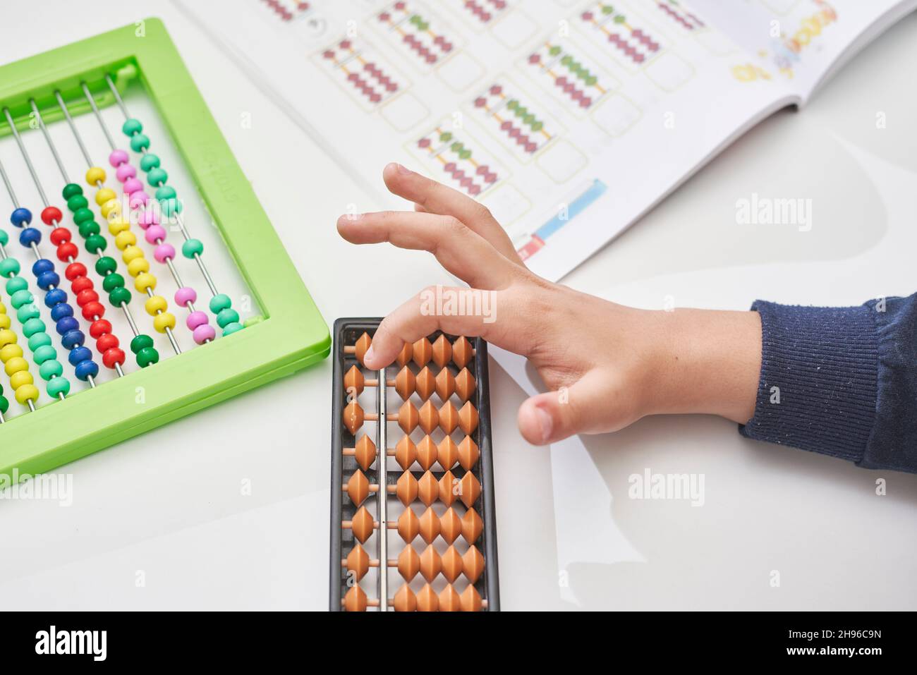 Schoolboy do mental math. Mental mathematics. 8 years old multiracial ...