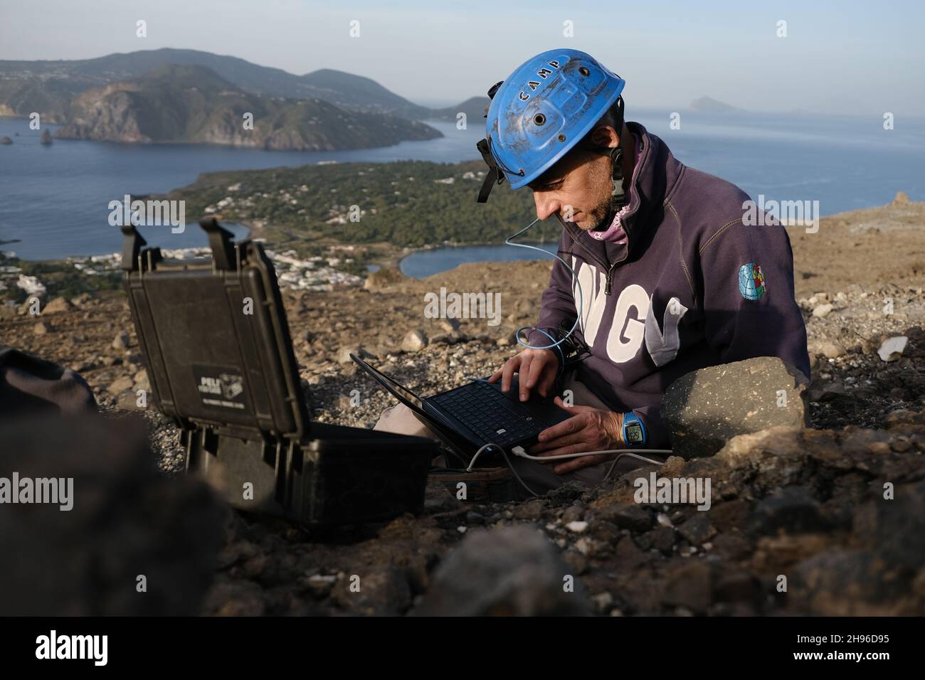An Italian vulcanologist of the INGV works on the main crater of ...