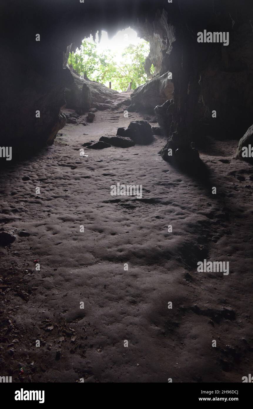 A view in front of a cave entrance Stock Photo - Alamy