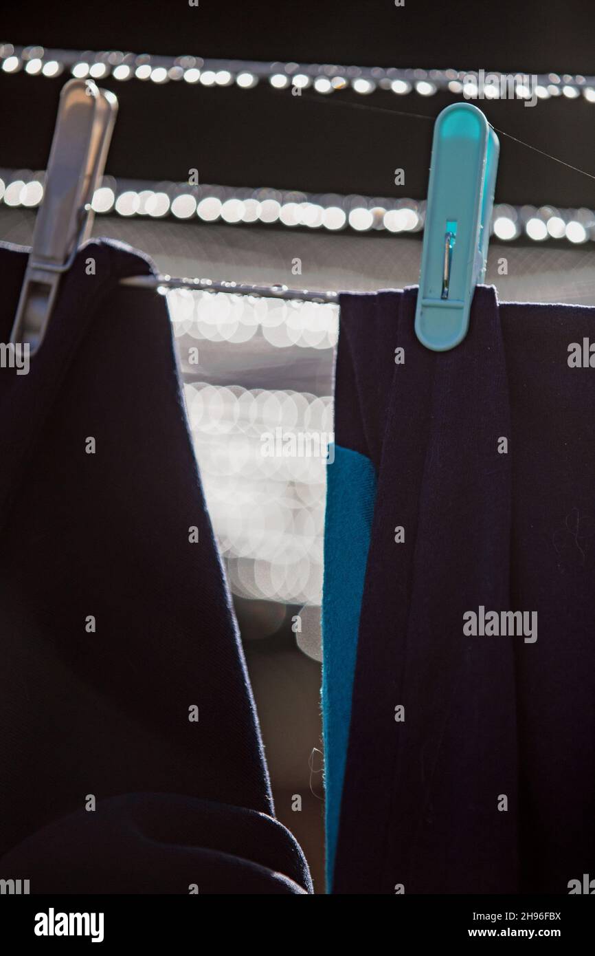 Items of laundry pegged to a wet washing line shot close up Stock Photo ...
