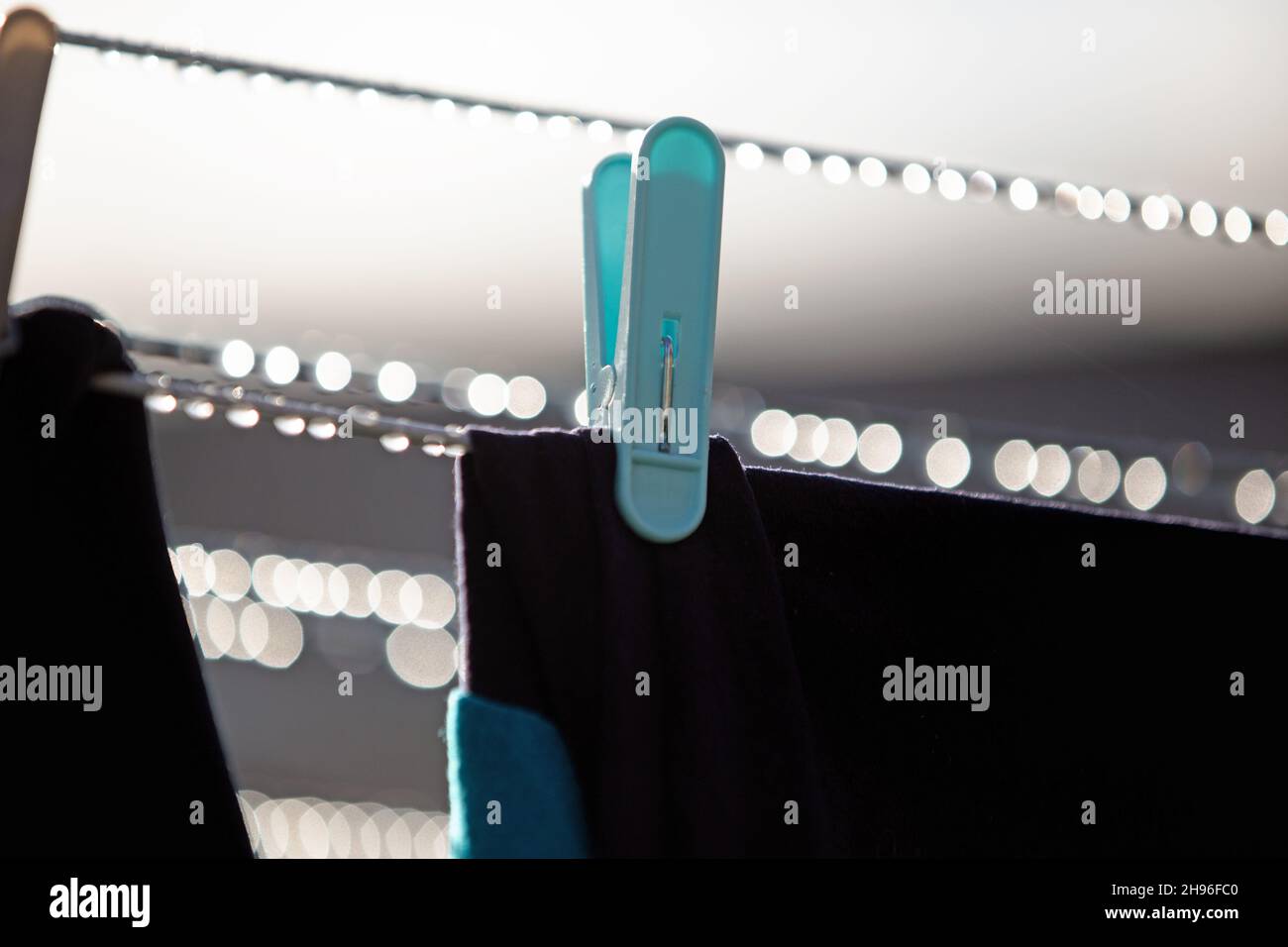 Items of laundry pegged to a wet washing line shot close up Stock Photo ...