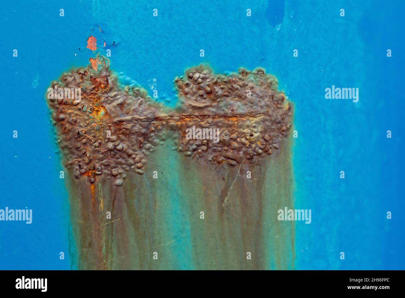 Painted iron surface with deteriorating surface showing rust coming ...