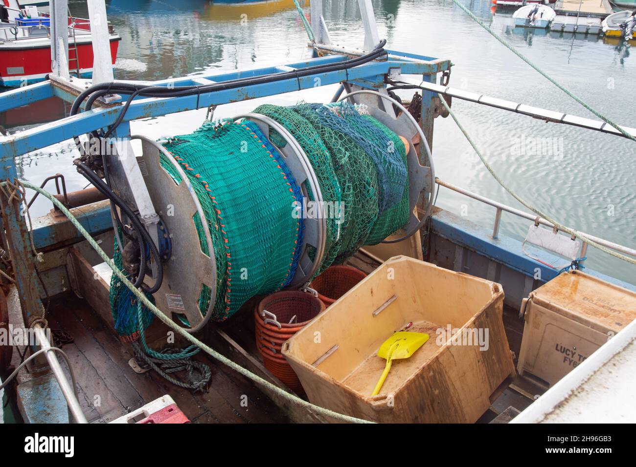 Padstow, Cornwall, England, December 2nd 2021, fishing nets rolled up ...