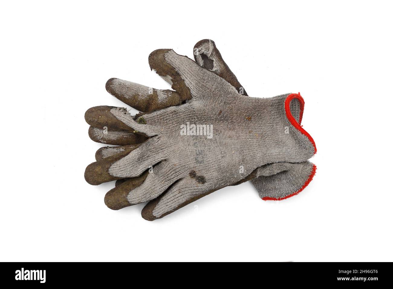 Used old dirty torn worker's gloves isolated on white background Stock ...