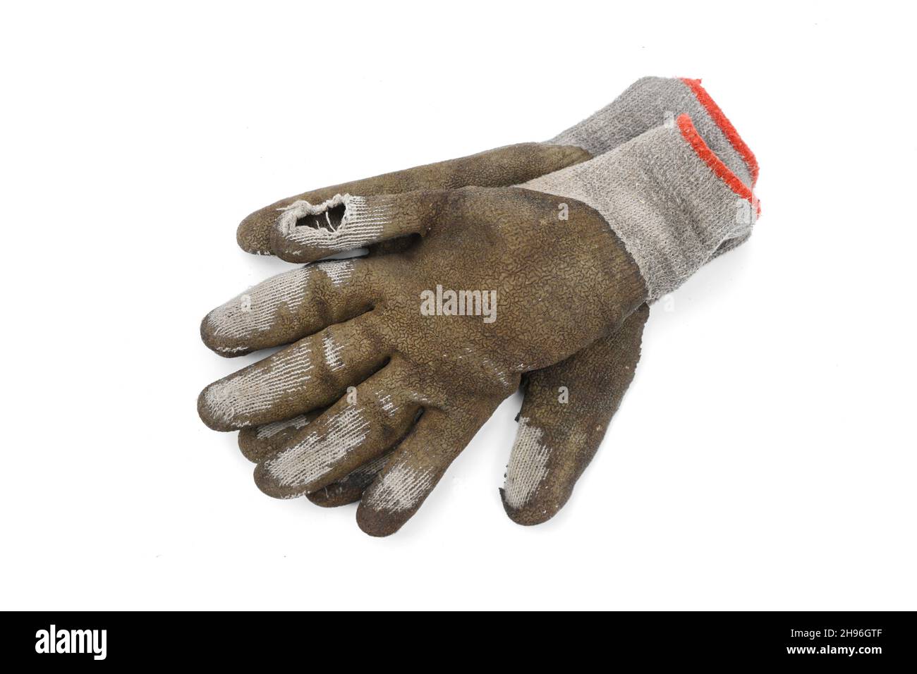 Used old dirty torn worker's gloves isolated on white background Stock ...