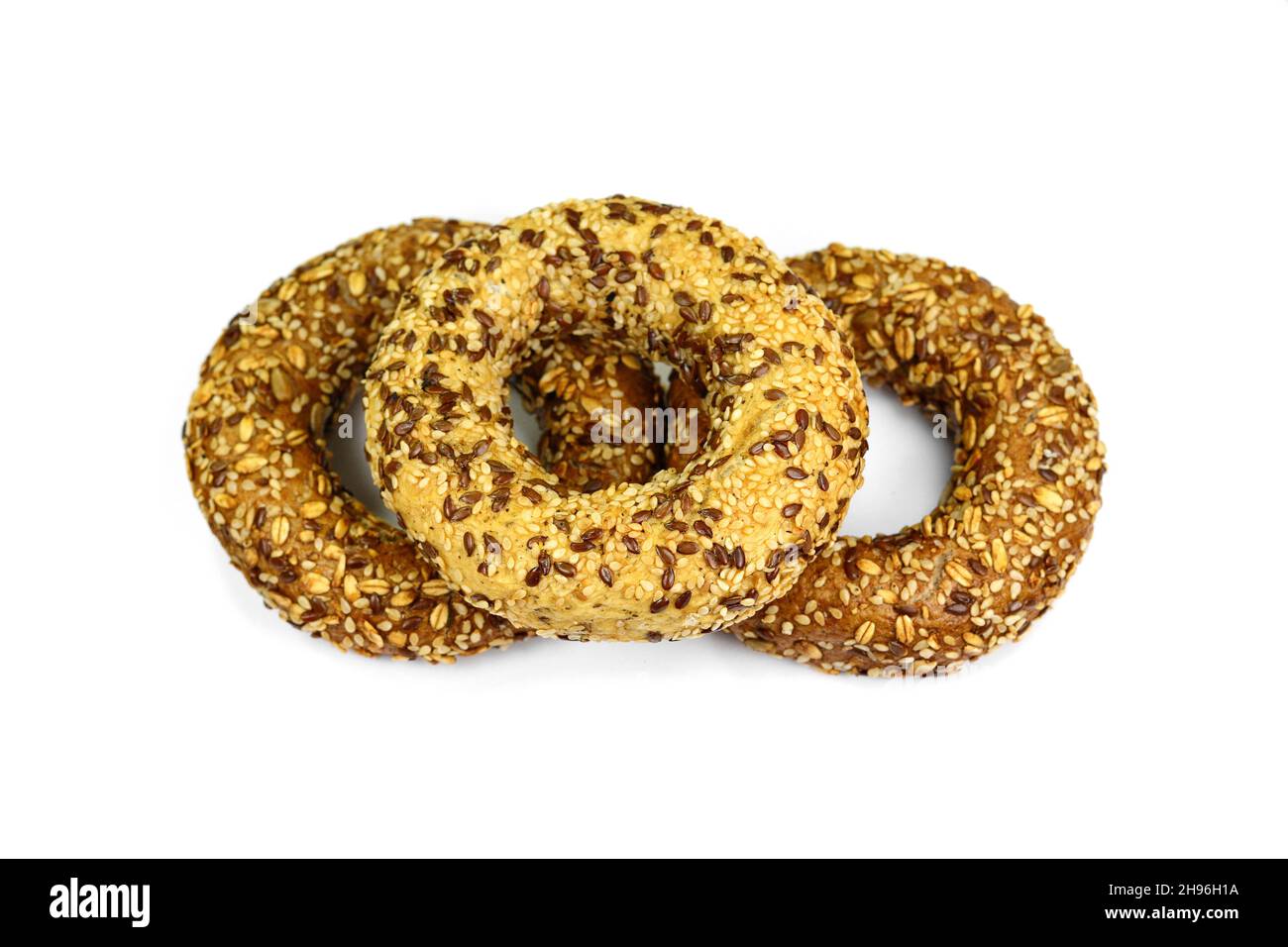 bagel with seeds isolated on white background. Fresh breakfast bread ...