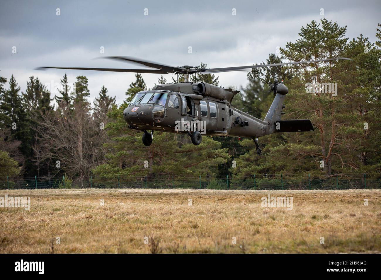 U.S. Army pilots fly UH-60 Black Hawks assigned to the 1-214th General ...