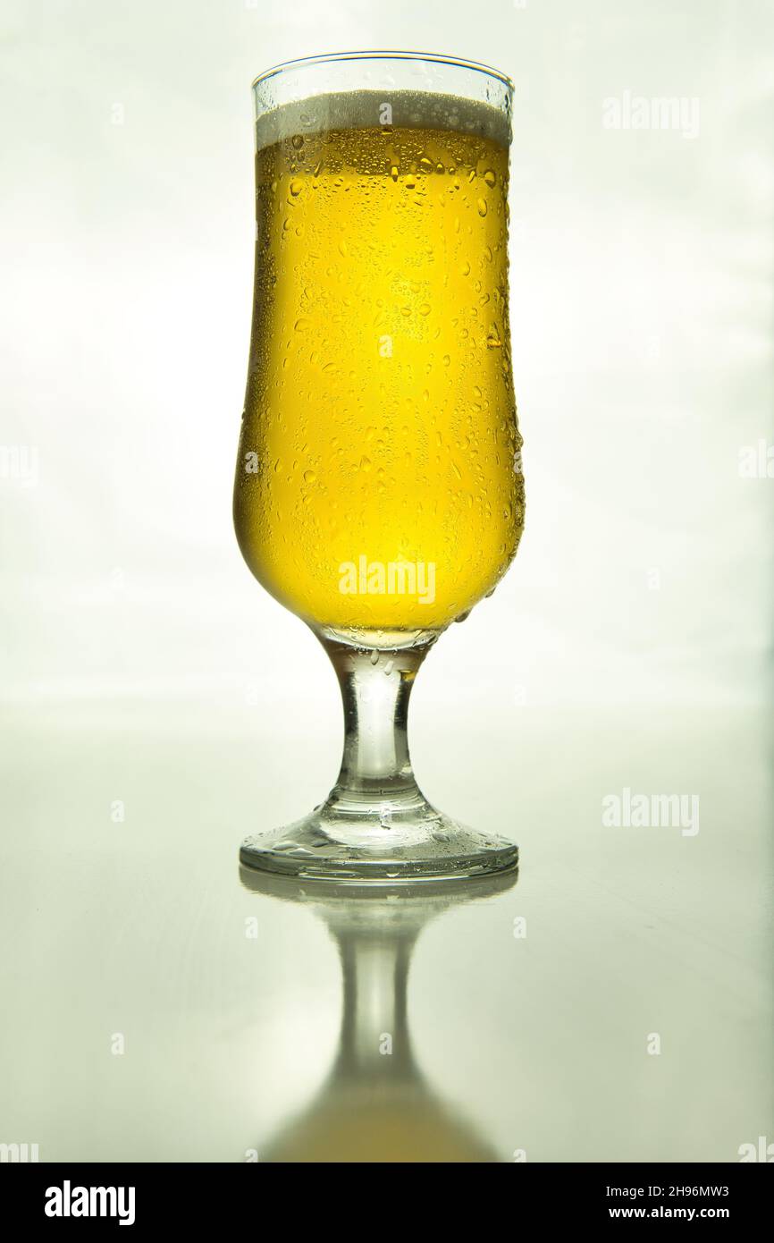 illuminated beer glass on white background, product Stock Photo - Alamy
