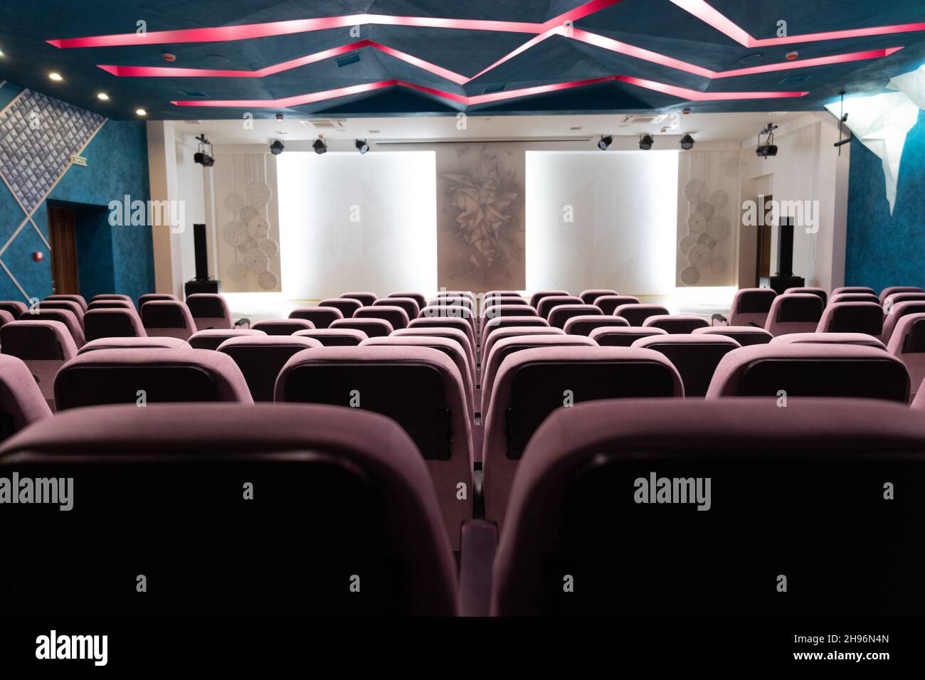 Interior of an empty concert hall with colored lighting Stock Photo - Alamy