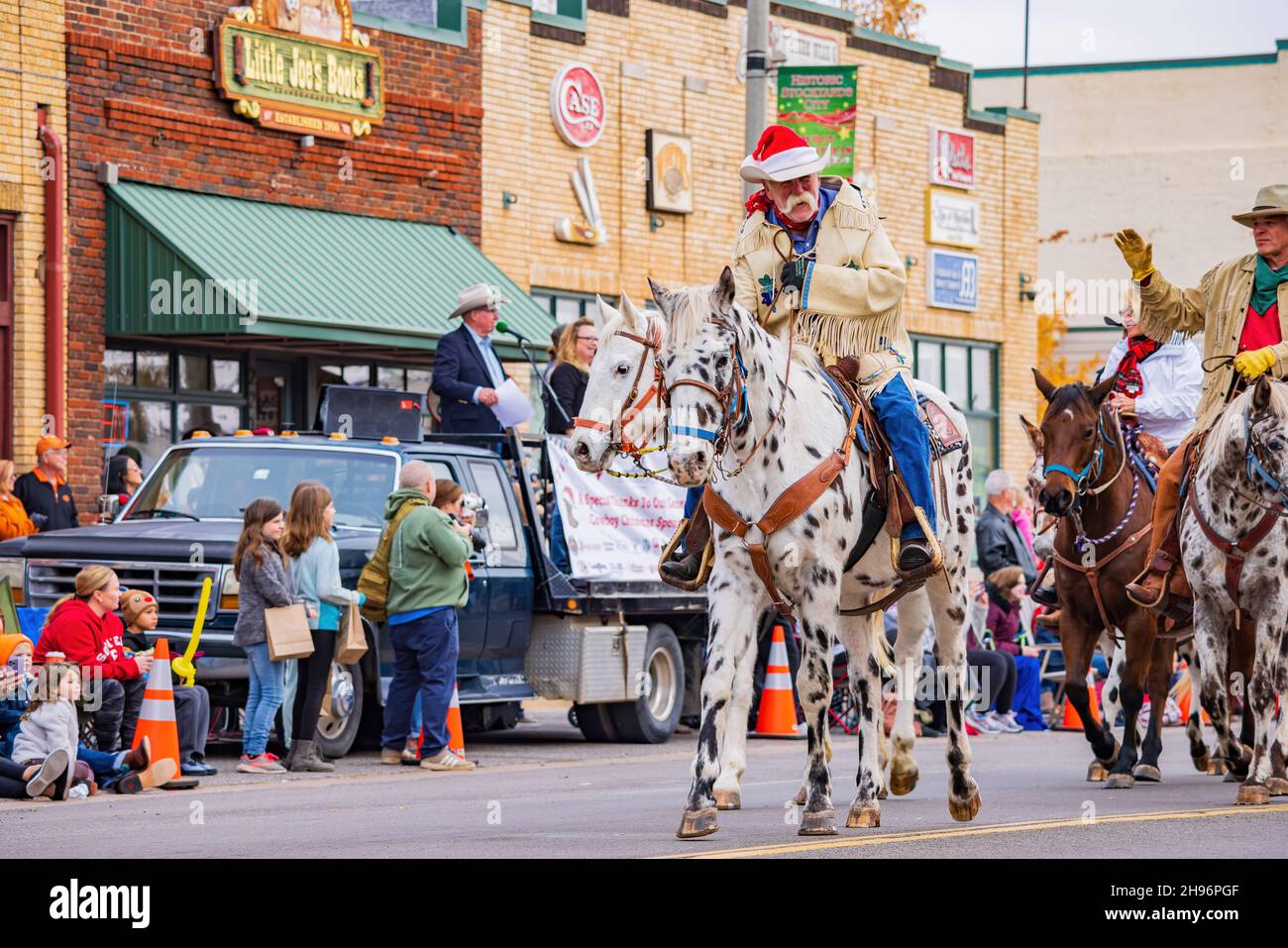 Oklahoma, DEC 4, 2021 - Cowboy and cowgirl riding horse in Cowboy ...