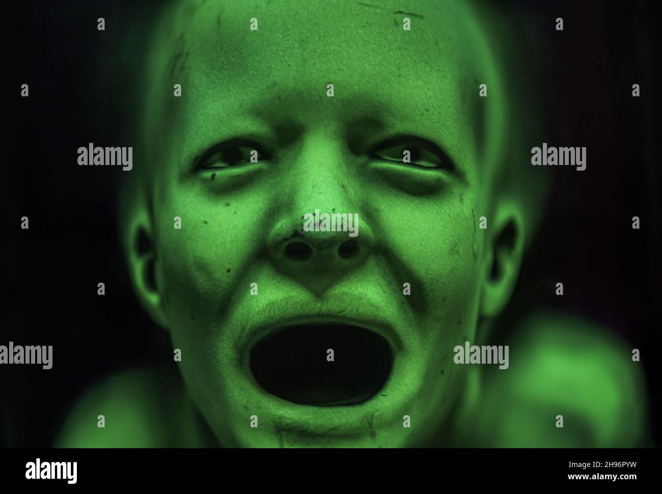 Closeup shot of a scary Halloween mask hanging from a wall Stock Photo ...