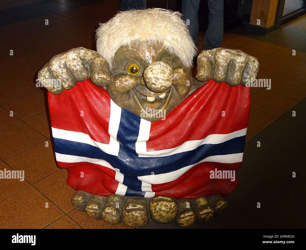 Cute troll figurine holding the flag of Norway Stock Photo - Alamy