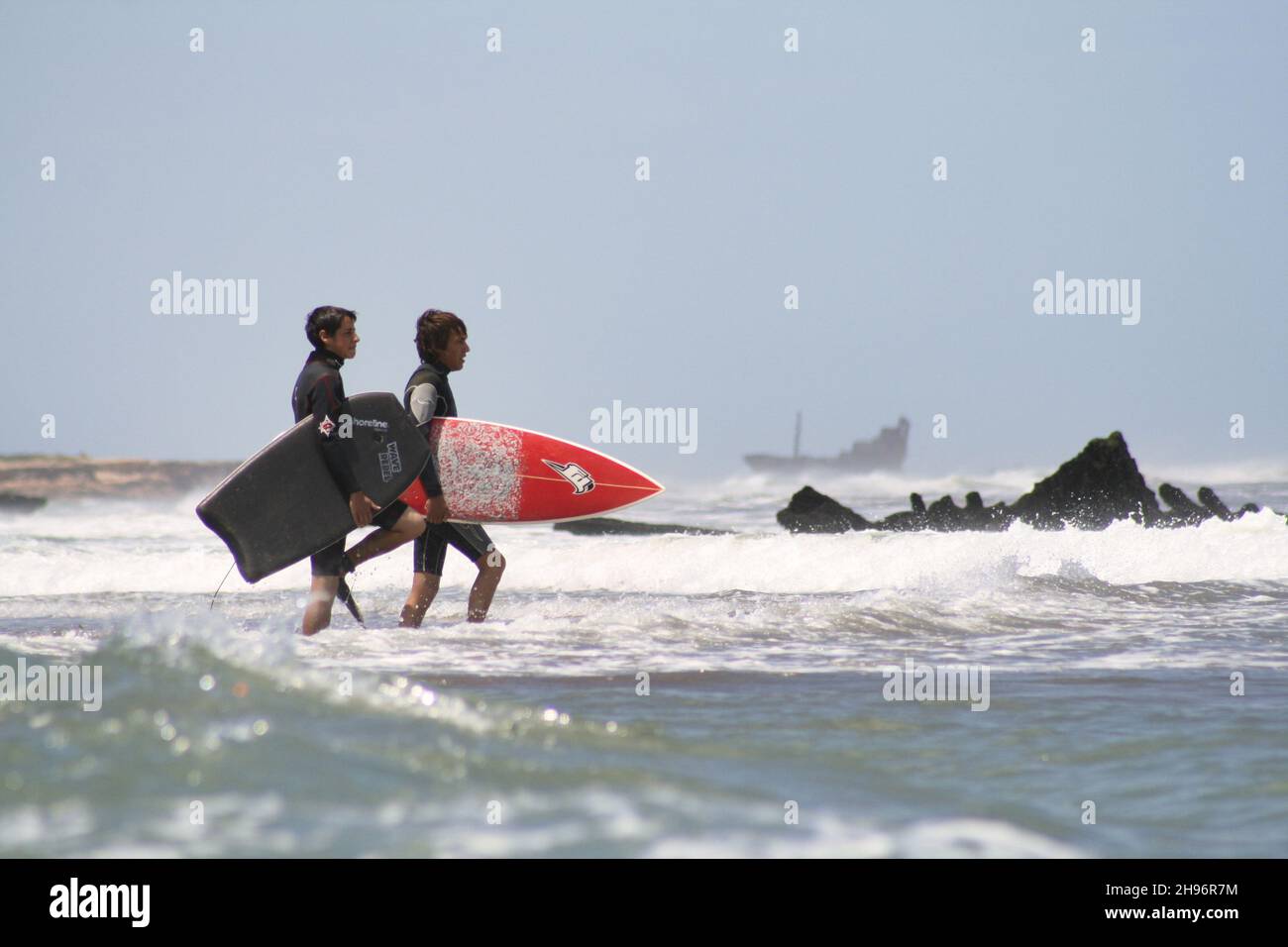 NECOCHEA, ARGENTINA - Sep 08, 2005: The surfers rushing waves at the ...
