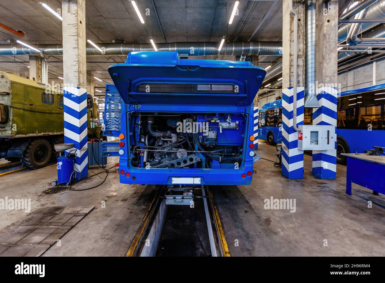 Buses in the modern repair service workshop Stock Photo - Alamy