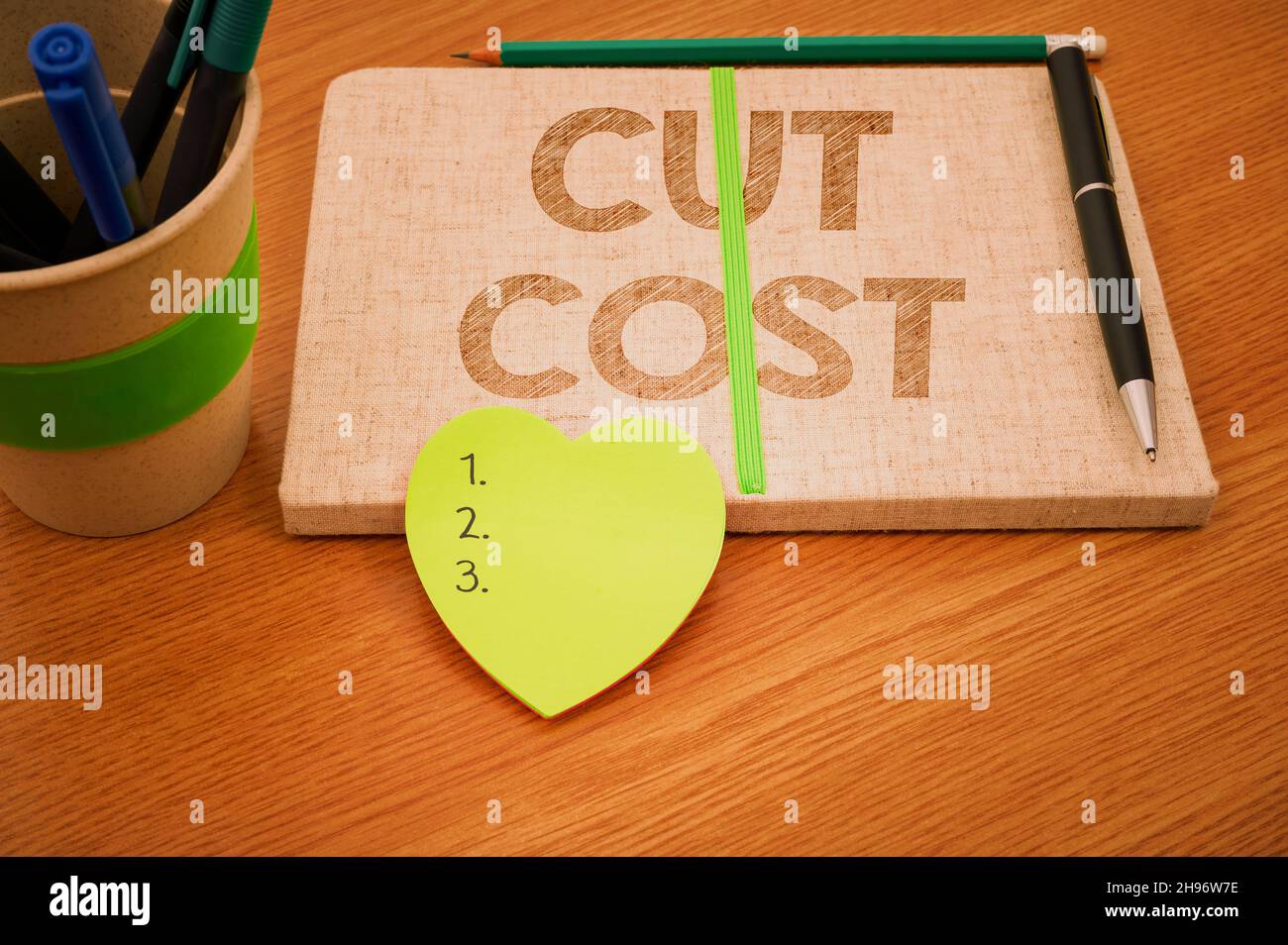 Handwriting text Cut Cost. Word Written on Measures implemented to ...