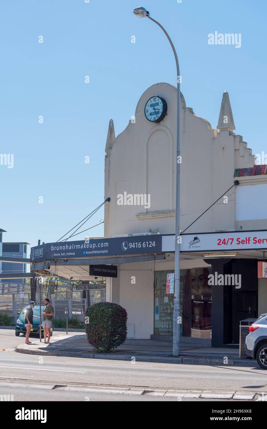Part of a larger strip of shops, the Mark Mayne (Dry Cleaners) clock is ...