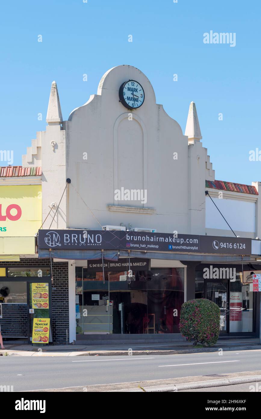 Part of a larger strip of shops, the Mark Mayne (Dry Cleaners) clock is ...