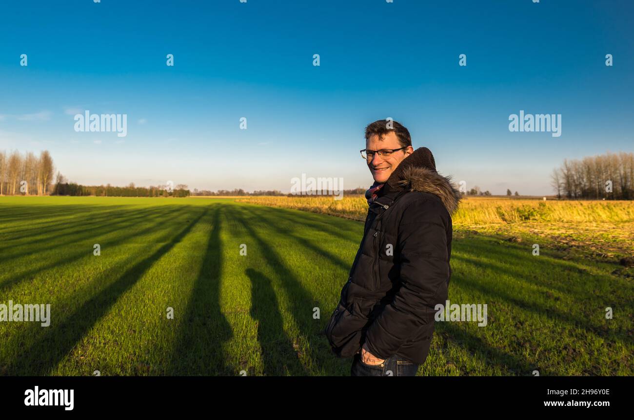 Man in winter coat side view hi-res stock photography and images - Alamy
