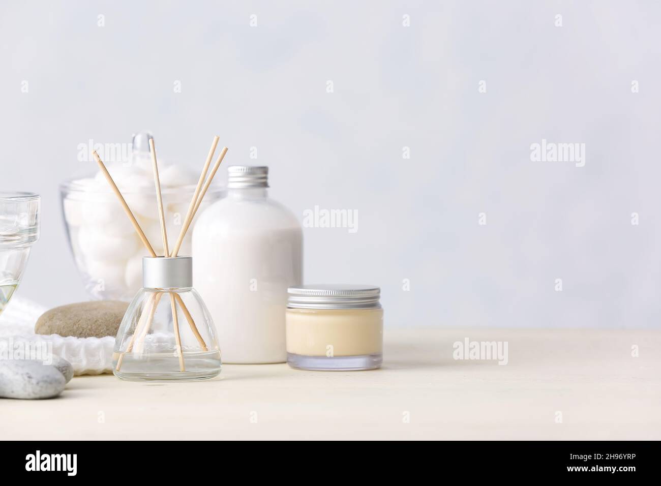 Spa set with cosmetics on light background Stock Photo - Alamy