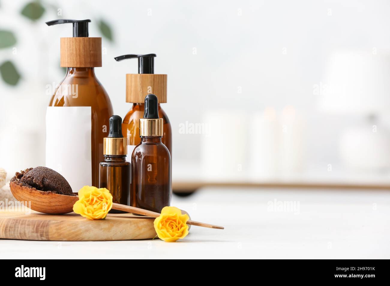 Spa set with bottles of cosmetics on light background Stock Photo - Alamy