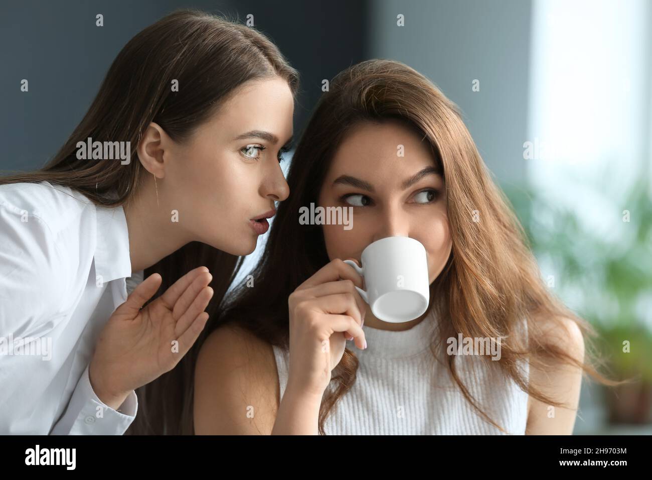 Gossiping in office hi-res stock photography and images - Alamy