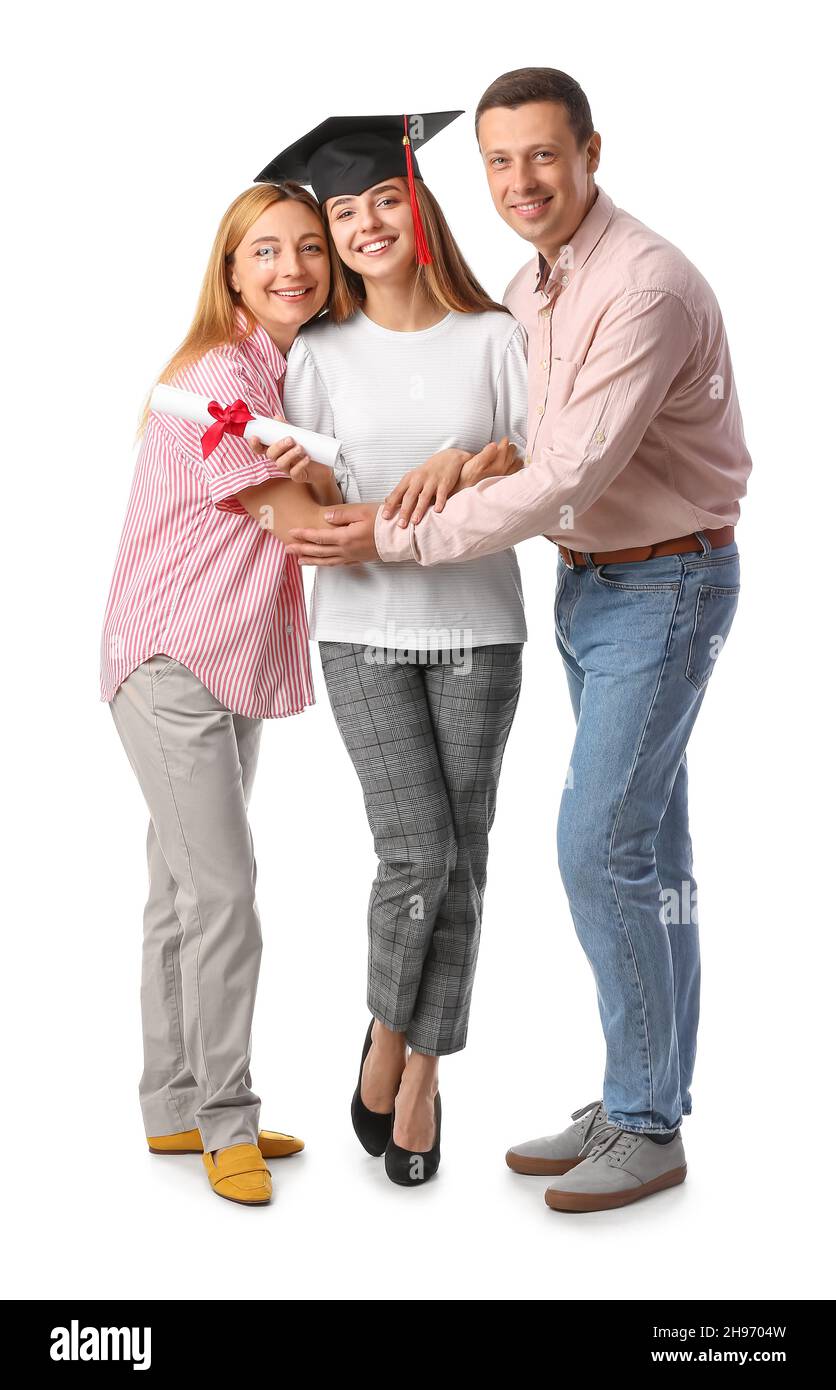 Happy female graduation student with her parents on white background ...